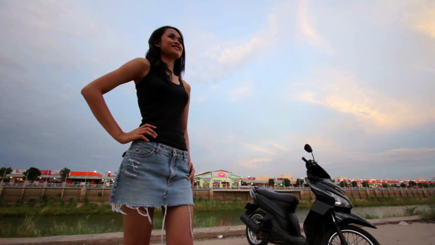 Sexy Asian Girl With Mini Skirt Next To Motorcycle Stock Footage Video