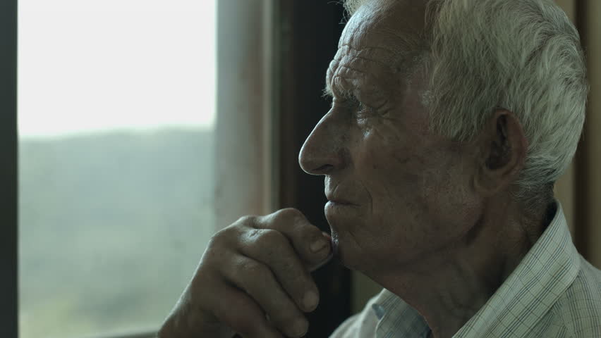 Thoughtful Old Man Sitting Alone Near A Window Pensive Aged Man Sad