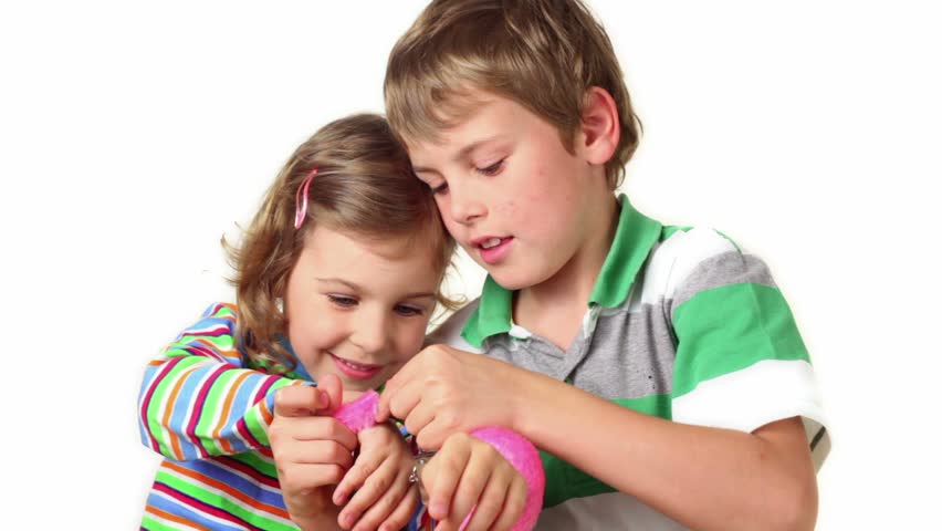 Two Children Boy And Girl Plays With Furry Handcuffs, Boy Put Them Up ...