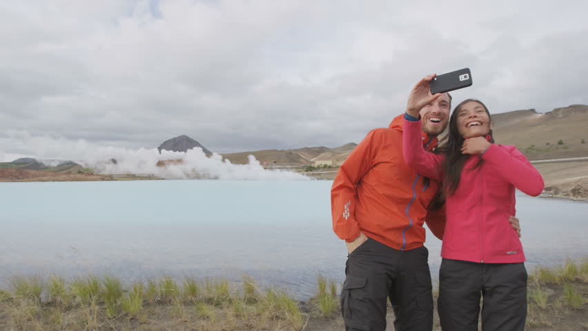Iceland Tourists Couple Taking Selfie Photo With Smartphone Camera At ...
