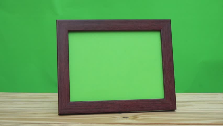 Single Picture Frame With Green Screen On Side Table. With Decoration ...