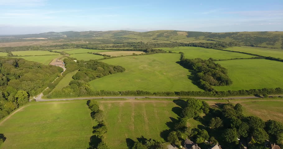 Stunning Aerial Shot Over Lush Green Fields And Meadows In The English ...
