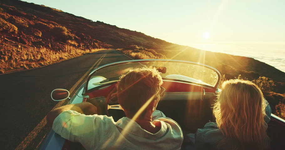 Car Driving Into Sunset