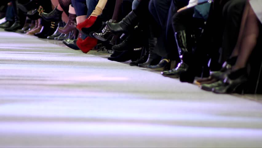 Model Walks The Runway, Black Shoes Close-up In Fashion House Stock ...
