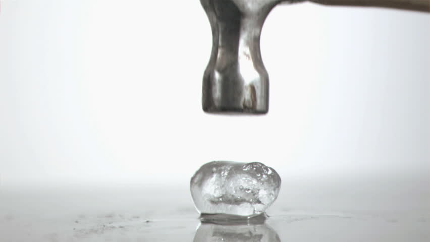 Hammer Breaking In Super Slow Motion An Ice Cube Against White ...