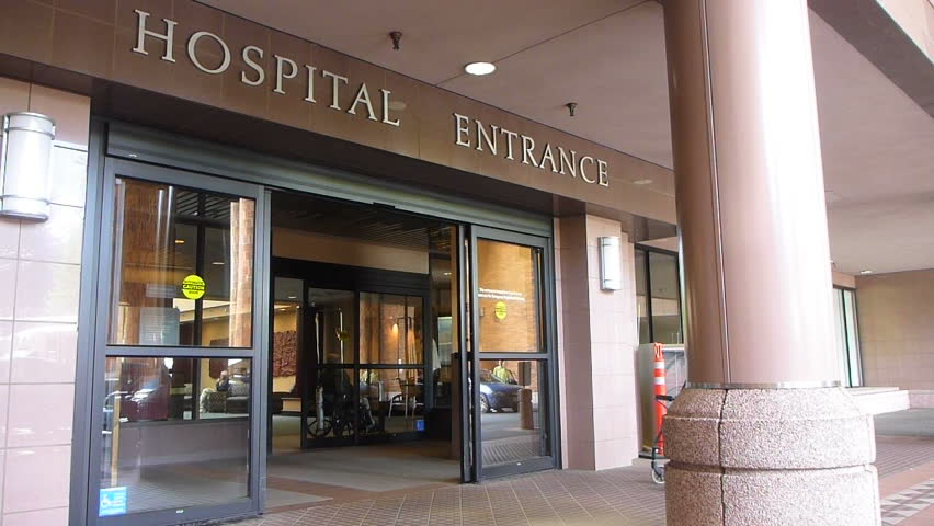 Time Lapse Effect At Hospital Entrance With Patients Entering And ...
