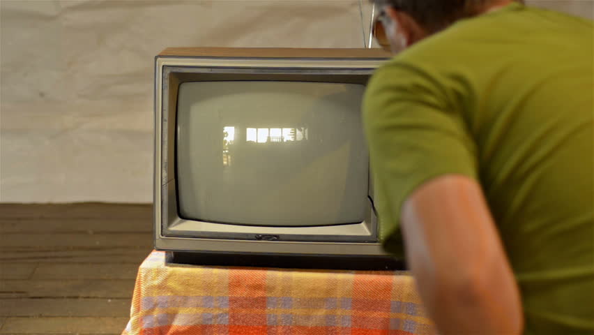 An Angry Man, Frustrated That His Old Television Isn't Working, Smashes ...