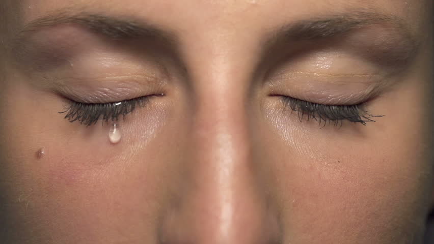 SLOW MOTION: Tear Comes Out Of An Eye And Streaks Down The Cheek ...
