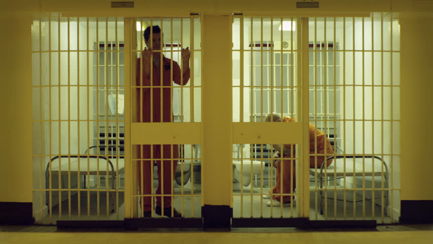 Two prisoners do some exercises in their cells. - HD stock footage clip