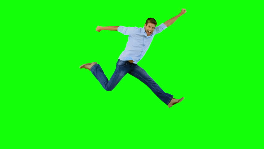 Man Jumping And Gesturing On Green Screen In Slow Motion Stock Footage ...