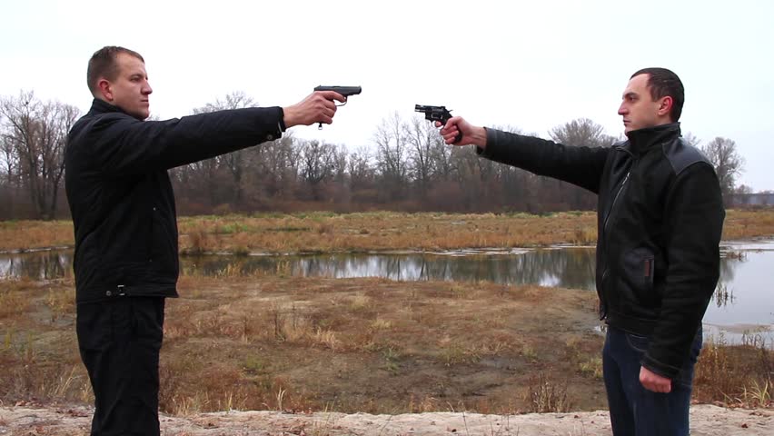 Two Men Pointing Guns At Each Other Stock Footage Video 2130347 ...