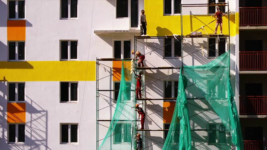 Construction Works, Workers Finishing The Process Of Painting The Wall ...