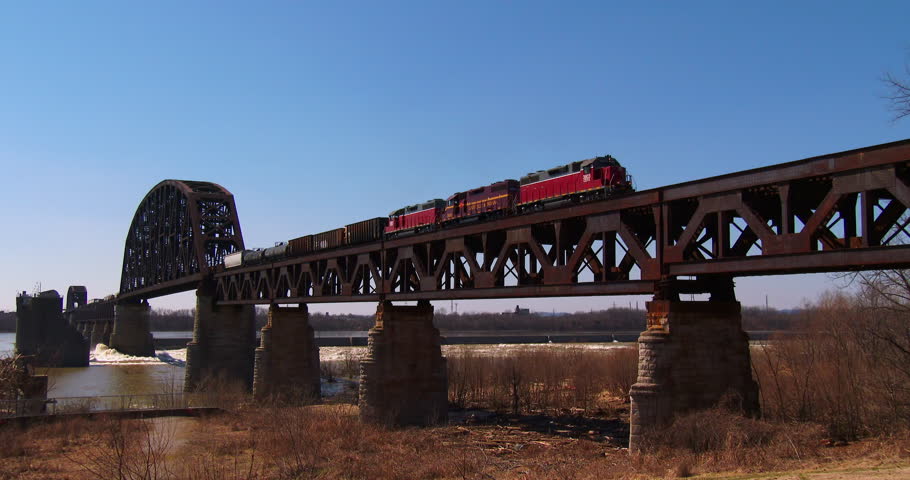 CIRCA 2014 - Freight Train Moves Across A Tall Steel Bridge. Stock ...
