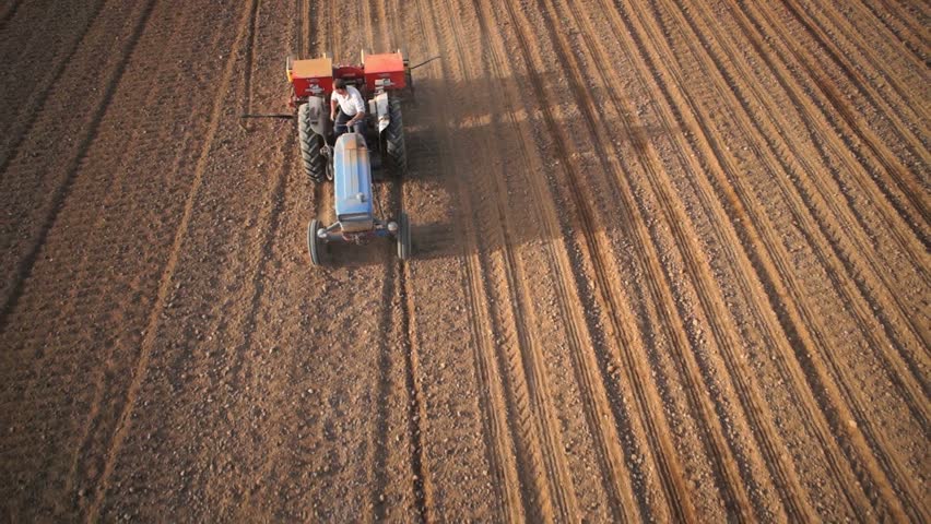 Aerial Of Tractor On Harvest Field (top View From Height) Stock Footage ...