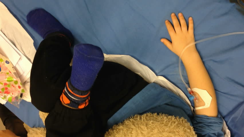 Child With IV Connected To His Arm During Treatment In A Hospital Stock ...