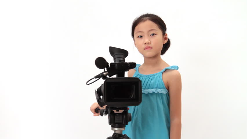 Little Girl Counts To Three And Operates A Video Camera Stock Footage ...